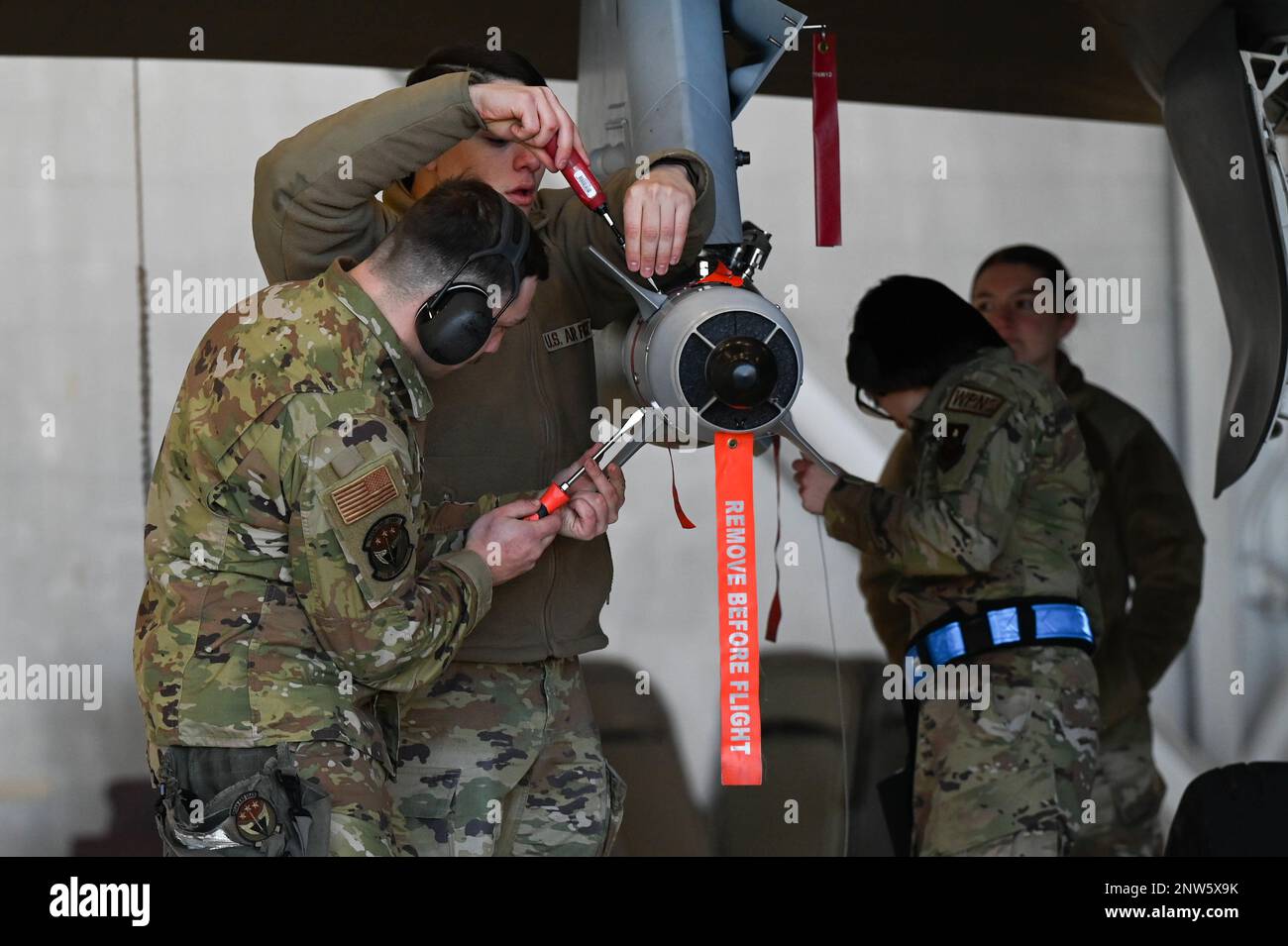 U.S. Air Force Staff Sgt. Trevor Fassett, left, a weapons load crew ...