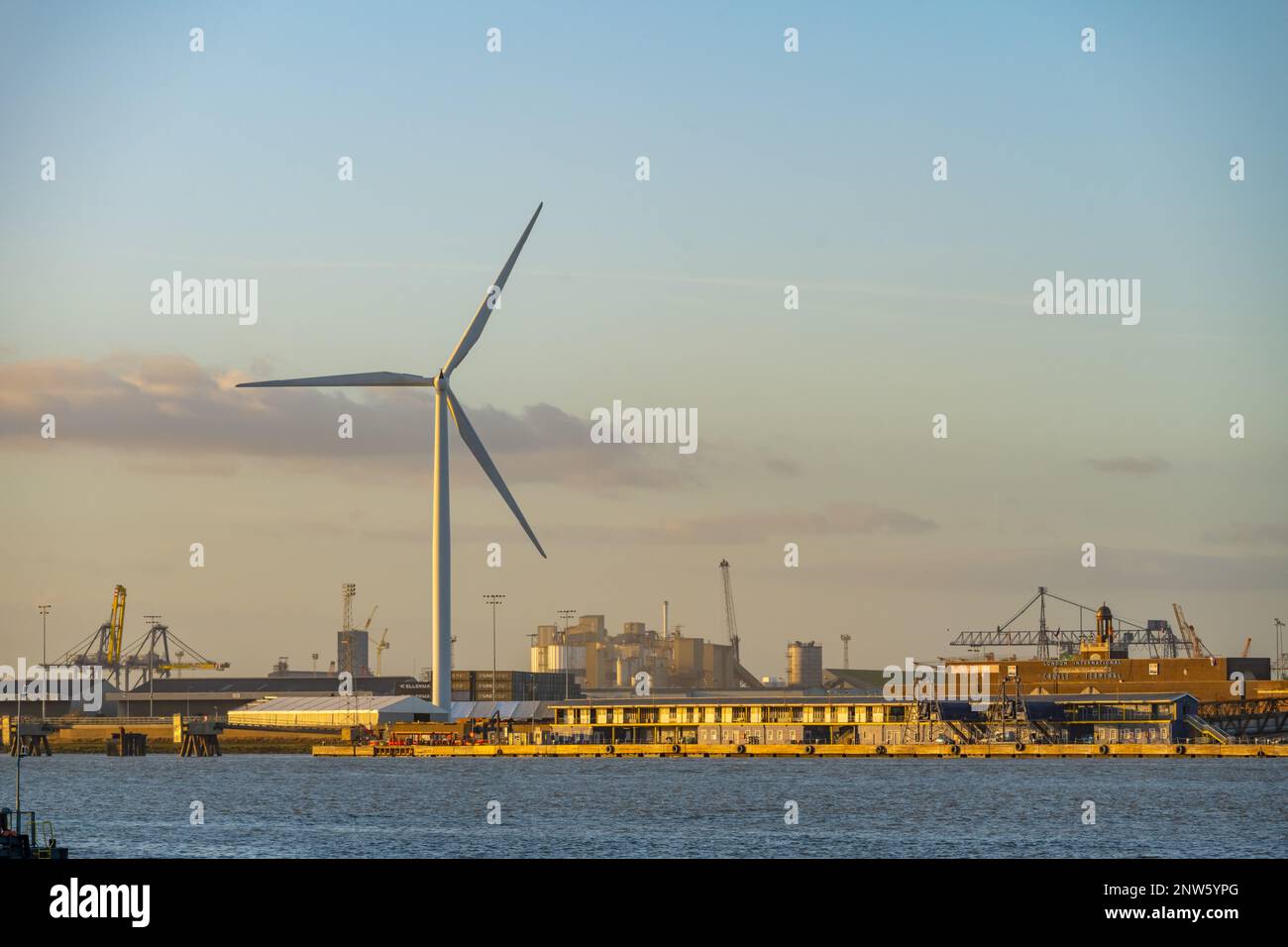 Wind turbine on Tilbury docks from the seafront at Gravesend Kent Stock ...