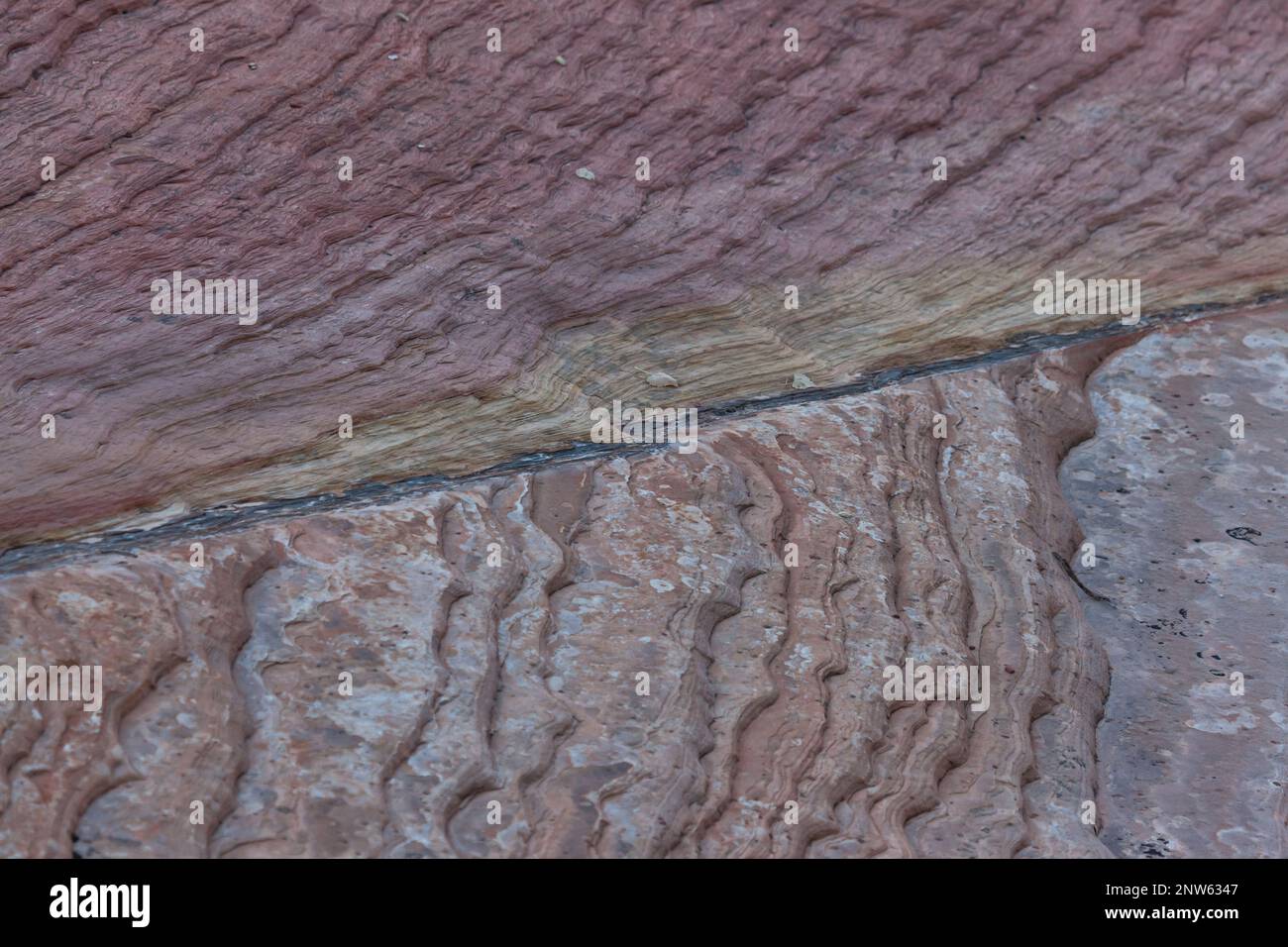 Layers of ancient sandstone rock in pastel colors in Zion National Park ...