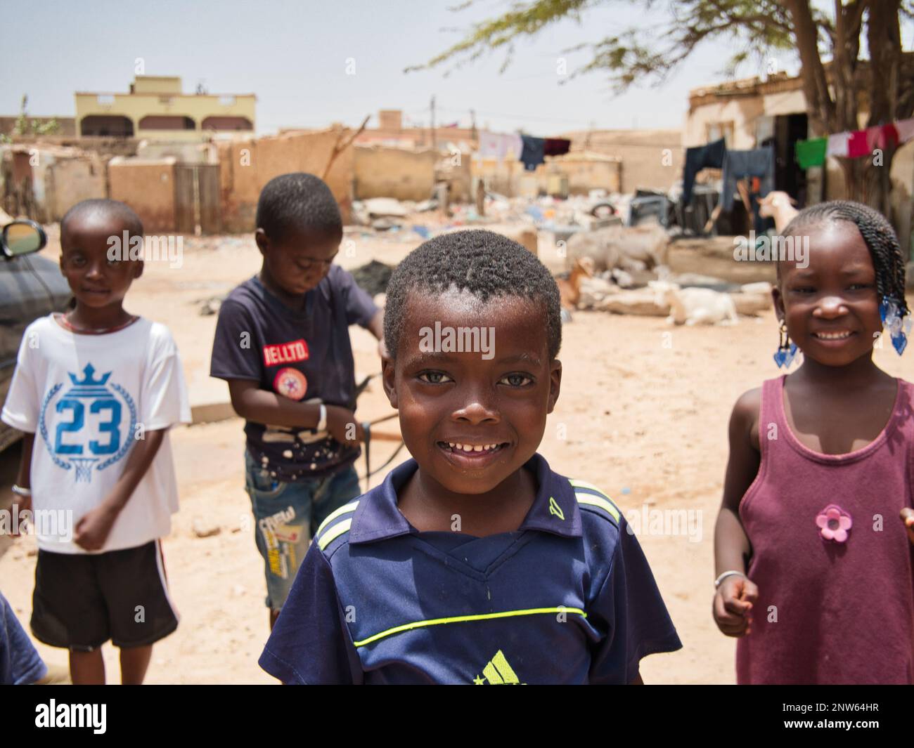 Happy african kids looking at the camera in the street Stock Photo - Alamy