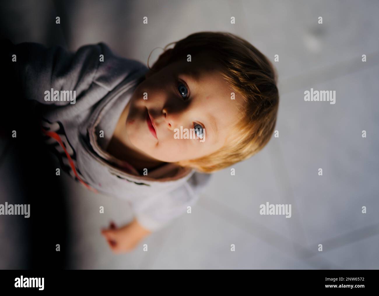 Boy Toddler Looking Up Into Camera Stock Photo - Alamy