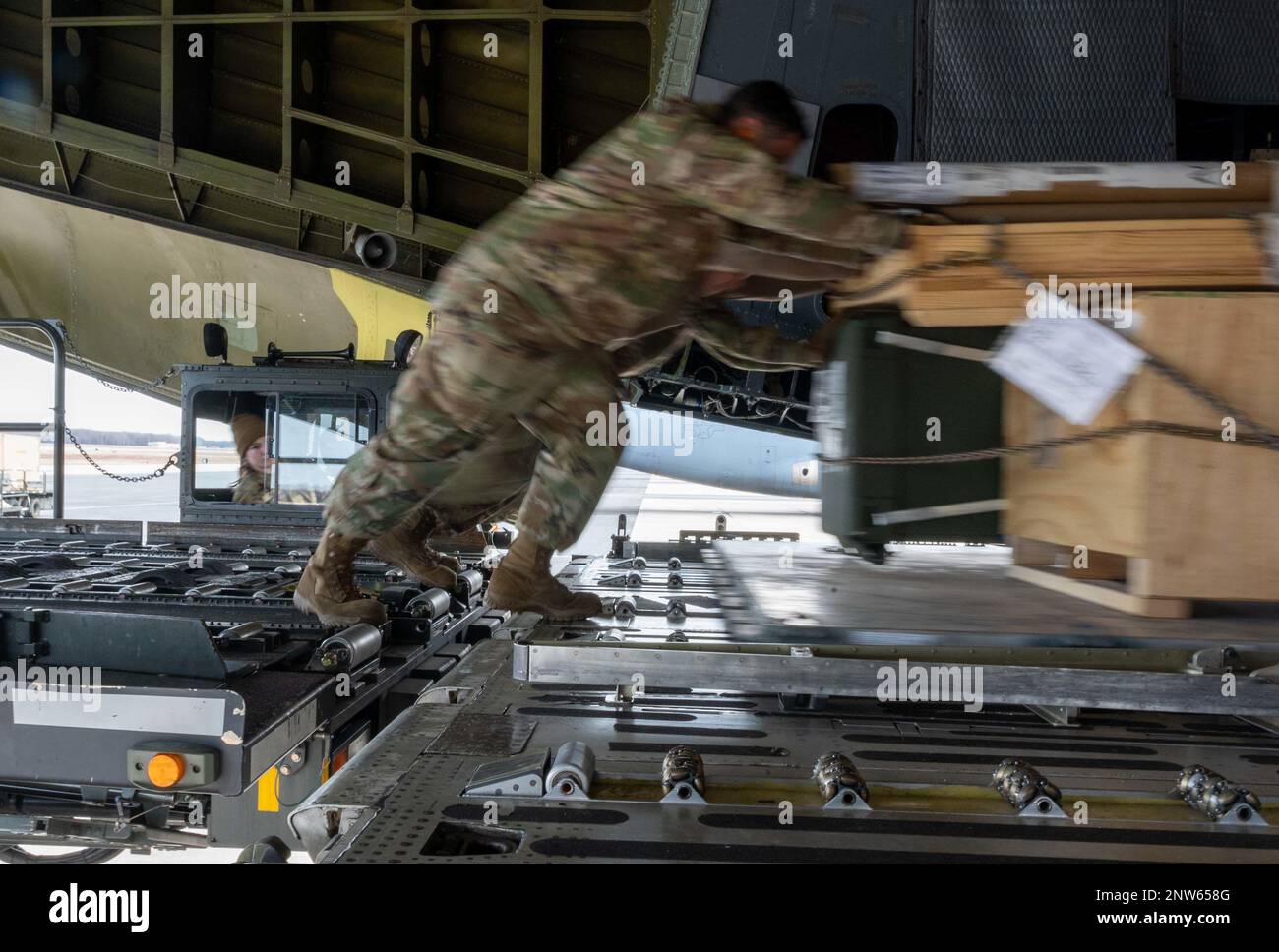 Airmen from the 436th Aerial Port Squadron load cargo onto a C-5M Super ...