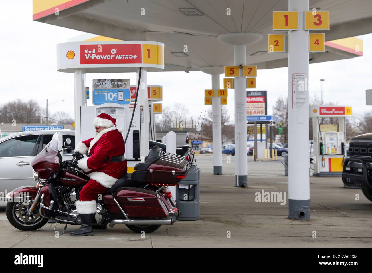Chet Bristow, of Jackson, fills the gas tank on his 2016 Harley ...