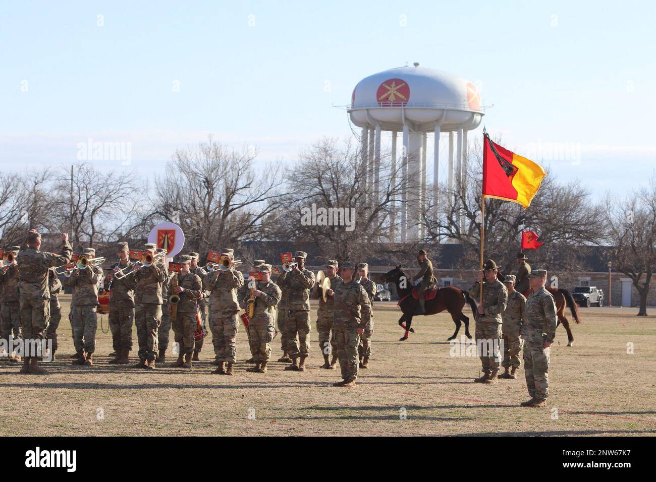 Spc. Tyler Carter and Staff Sgt. Devin Dew gallop their horses behind ...
