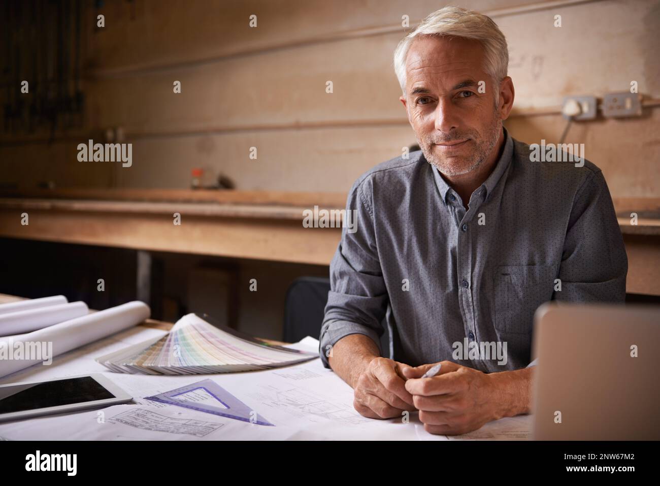 Turning his vision into reality. An architect drawing up plans Stock ...