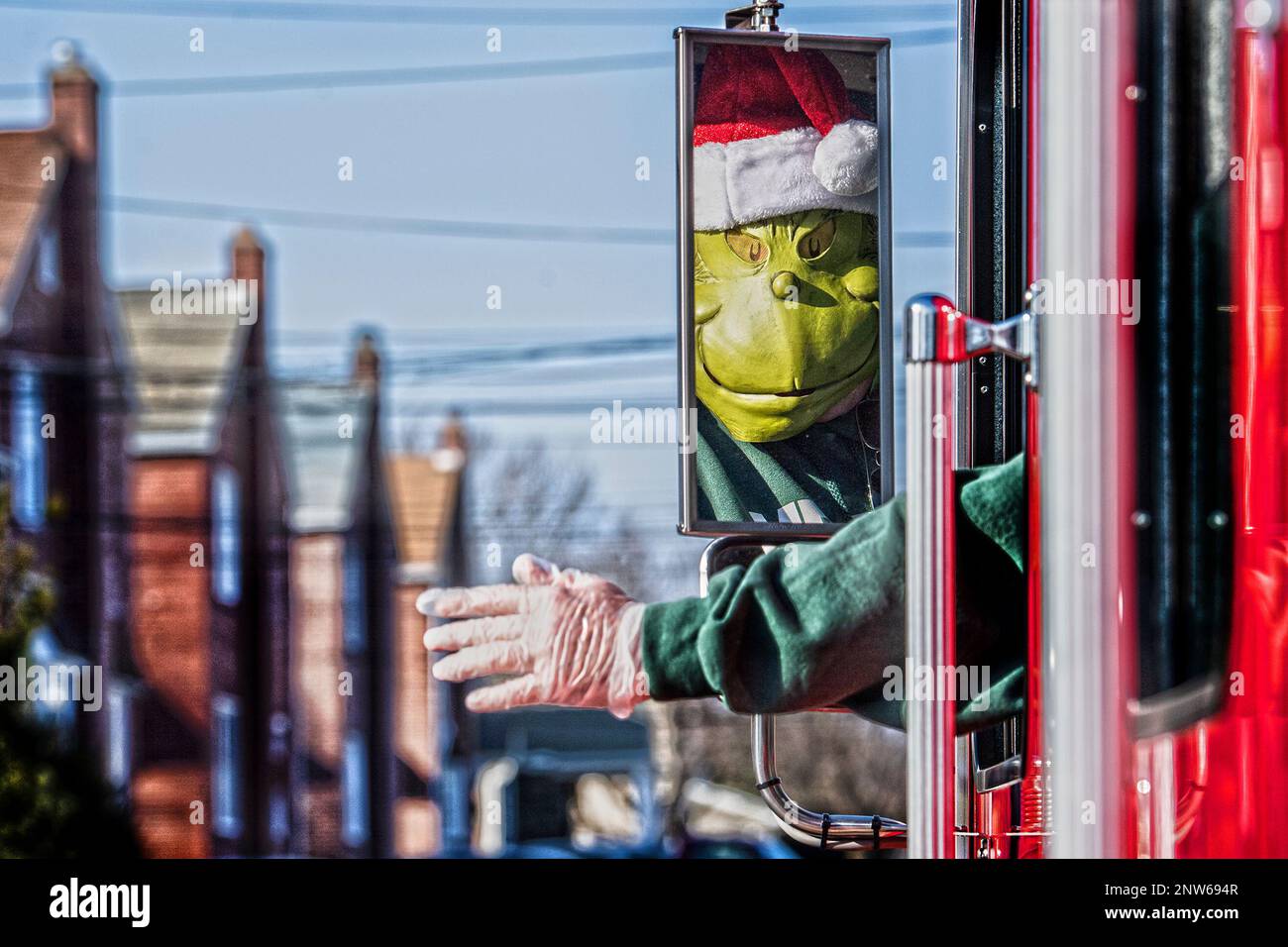 A firefighter from the Folsom Fire Department dressed as the Grinch ...