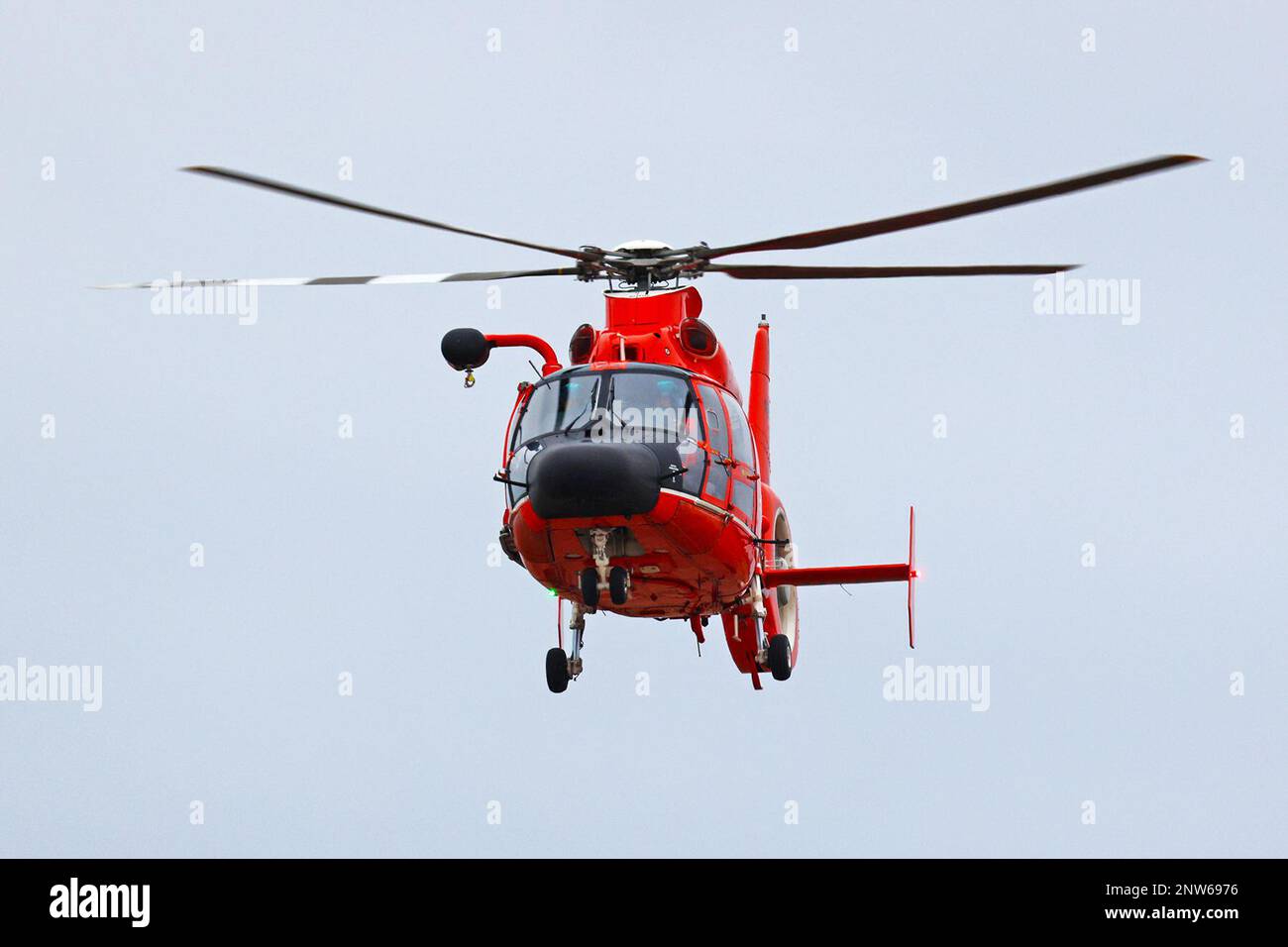 An MH-65 Dolphin helicopter takes flight during hoist rescue simulation ...