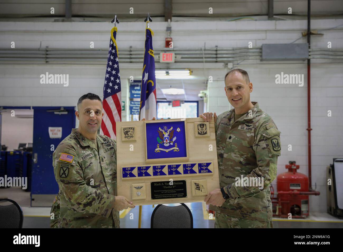 Command Sgt. Maj. Kirpal Barrientos presents a gift to outgoing ...