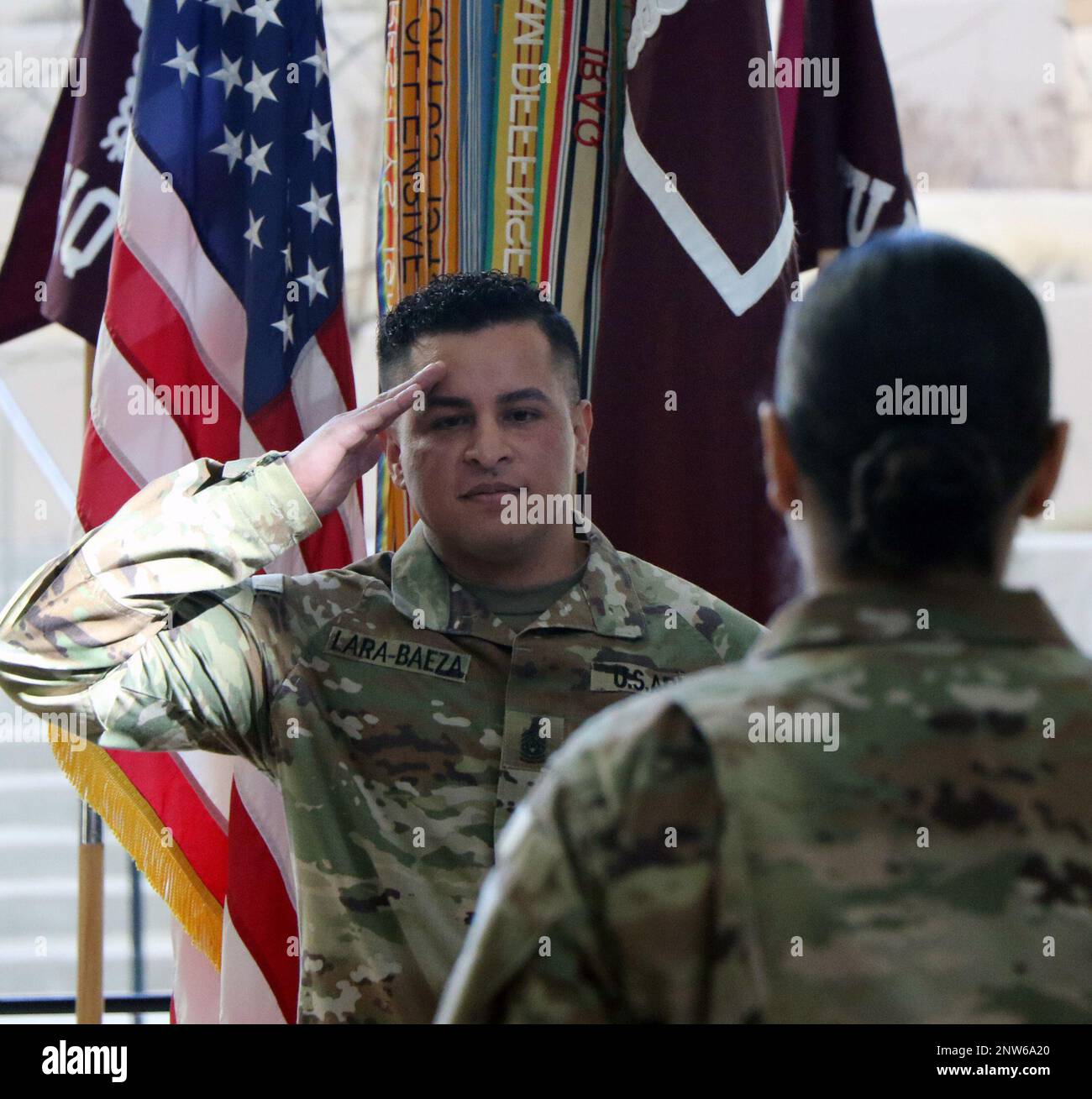 Command Sergeant Major Joel Lara-Baeza renders a salute to show that the transfer of command is ...
