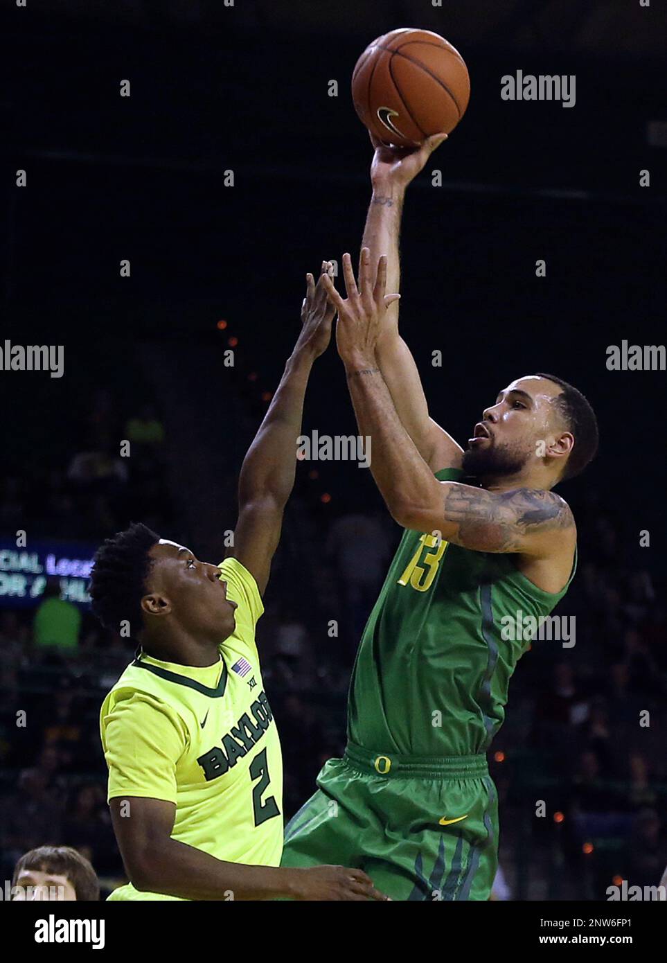 Oregon forward Paul White (13) attempts to shoot over Baylor guard ...