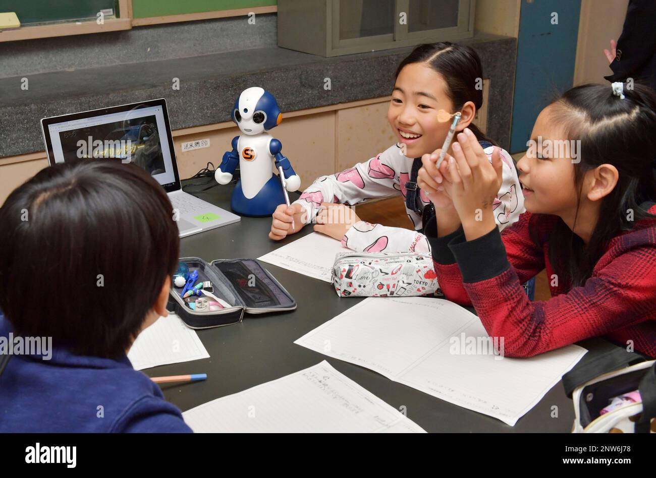 A robot named Sota joins a class with elementary school students in Tokyo on Dec. 20, 2018. The ...