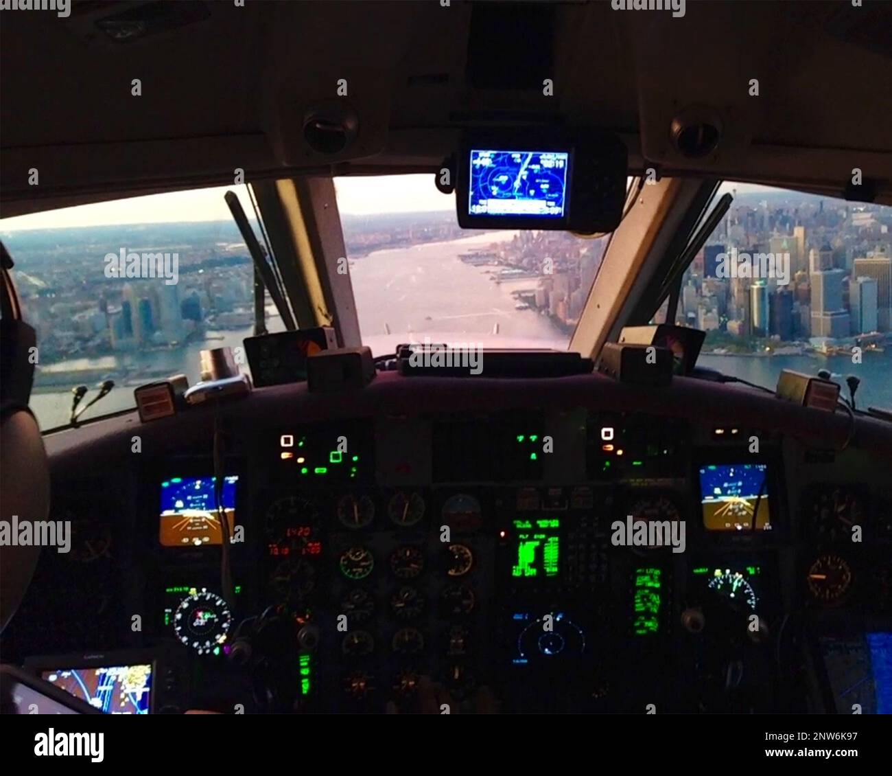 The crew of the 147th Attack Wing RC-26 flies above New York City, New ...