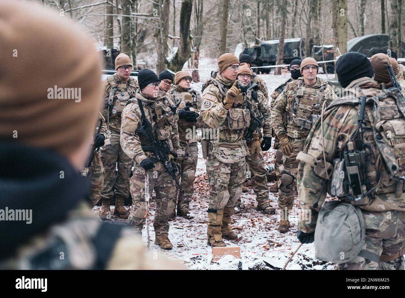 U.S. Army Soldiers, assigned to 2d Cavalry Regiment, receive an ...