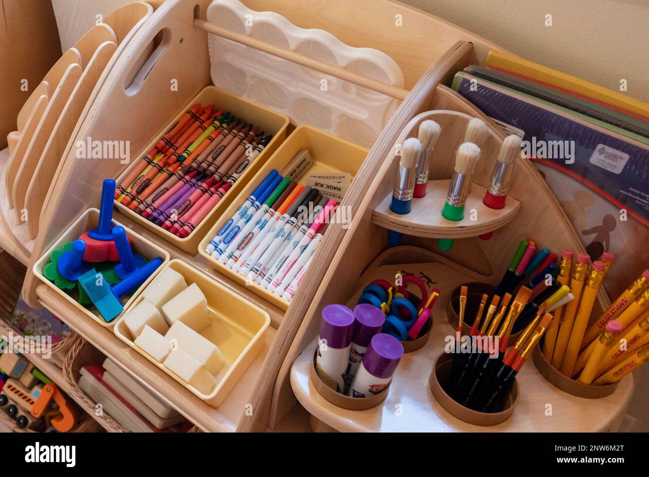 An art craft cabinet is filled with various supplies during the reveal ...