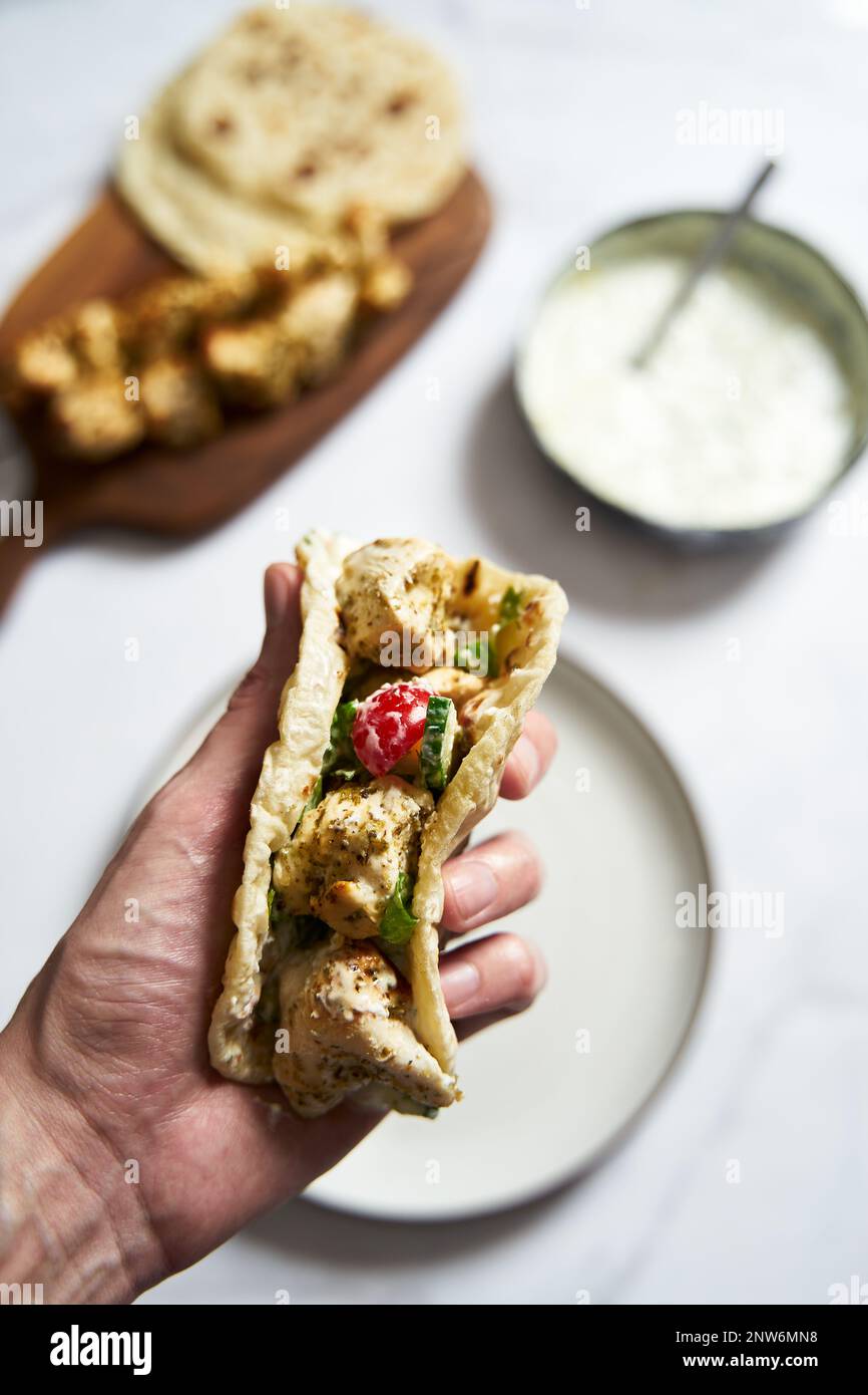 Greek chicken souvlaki ona pita with fresh vegetables with tzatziki ...
