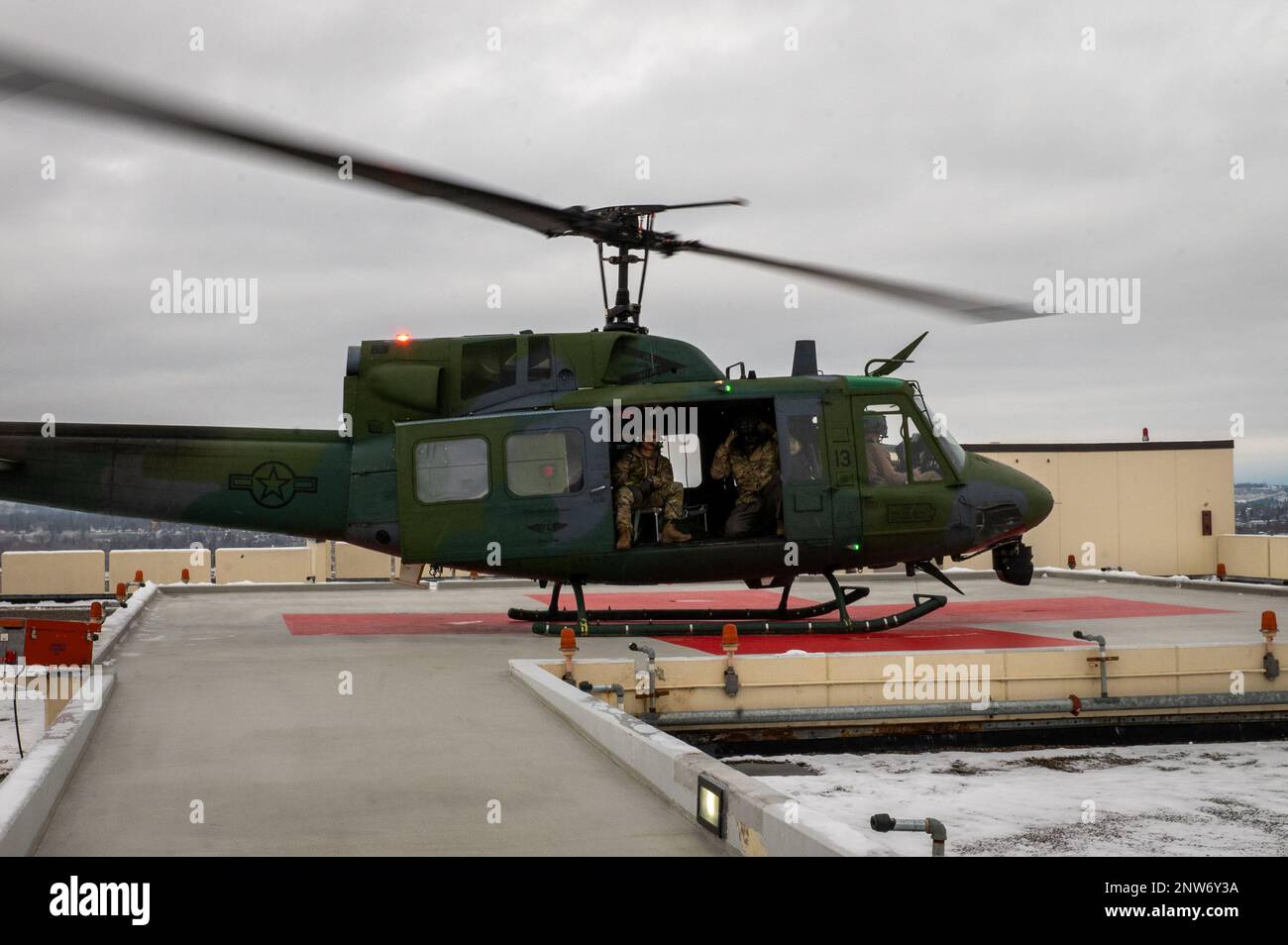 U.S. Air Force 36th Rescue Squadron members land a UH-1N Huey on a ...
