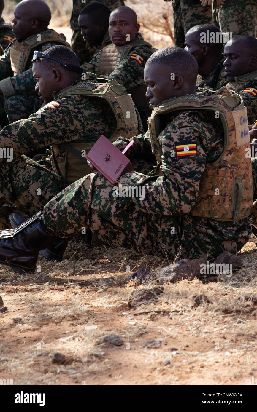 A Soldier from the Uganda military takes notes during a class on ...