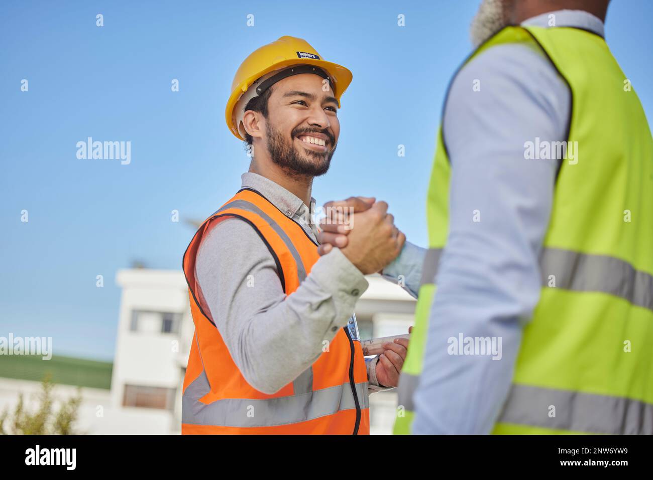 Engineer, men outdoor and greeting with handshake, partnership and ...
