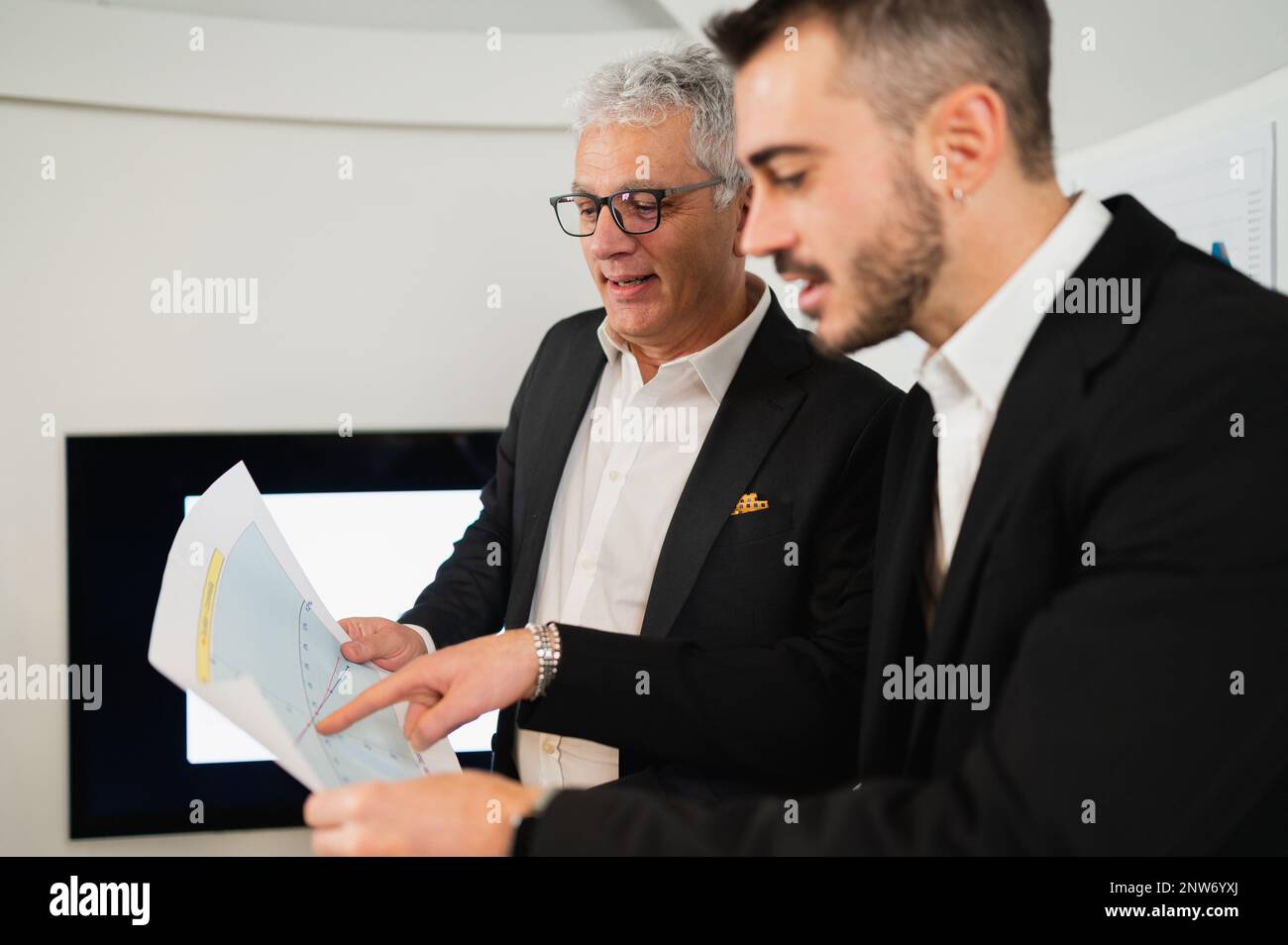 young businessman ask advice to senior colleague about a strategy ...