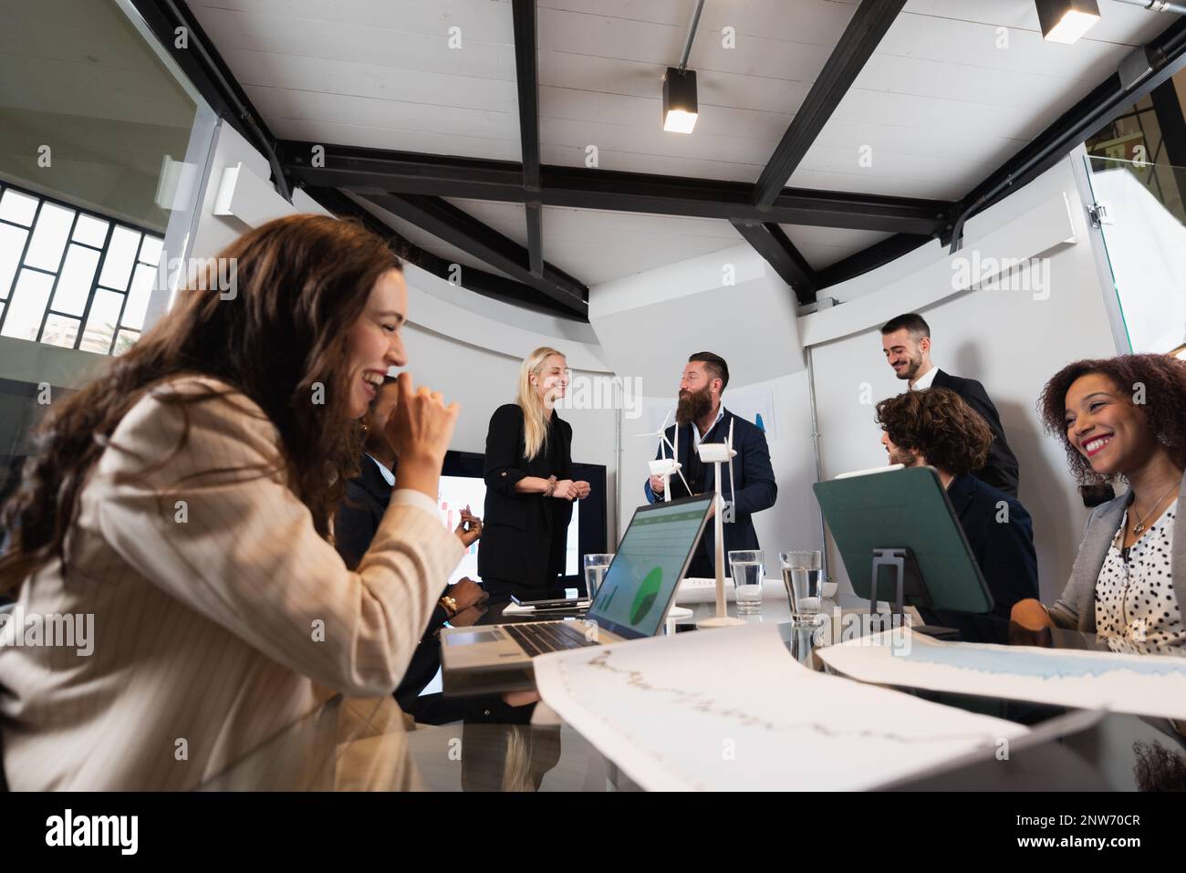 Multiracial group of businesspeople working on a business plan siting ...
