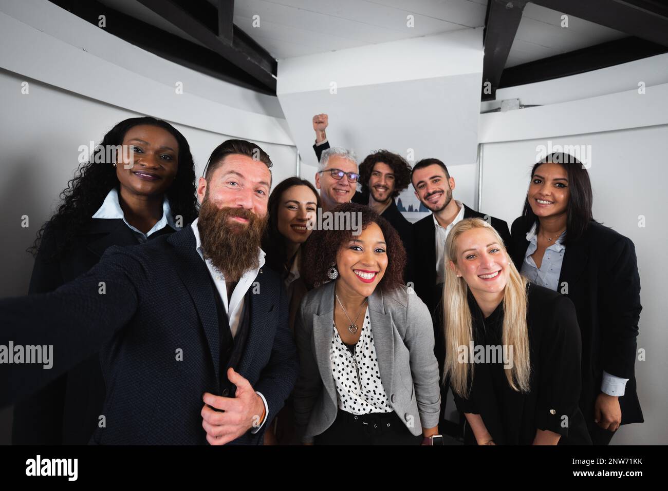 Group of happy colleagues of diverse ethnicity take a selfie photo with ...