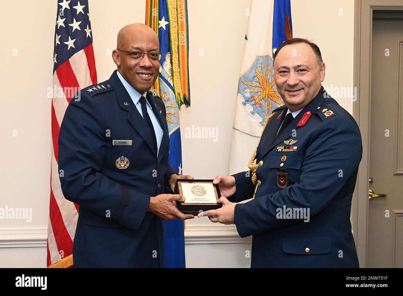 Chief of Staff of the Air Force Gen. CQ Brown, Jr., presents a gift to ...