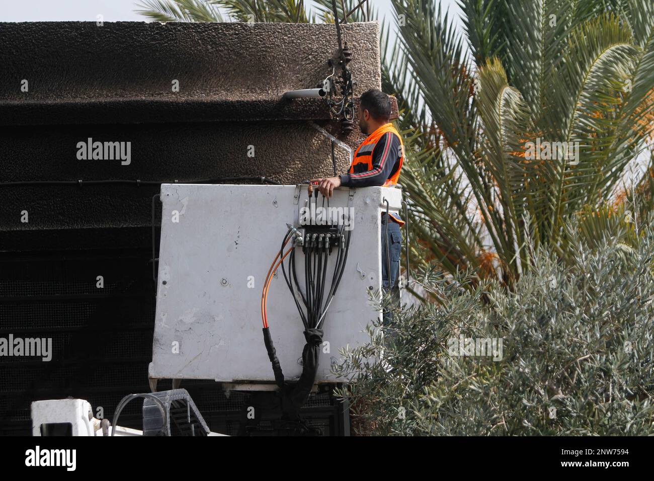 Nablus, Palestine. 28th Feb, 2023. A worker repairs the damages caused ...