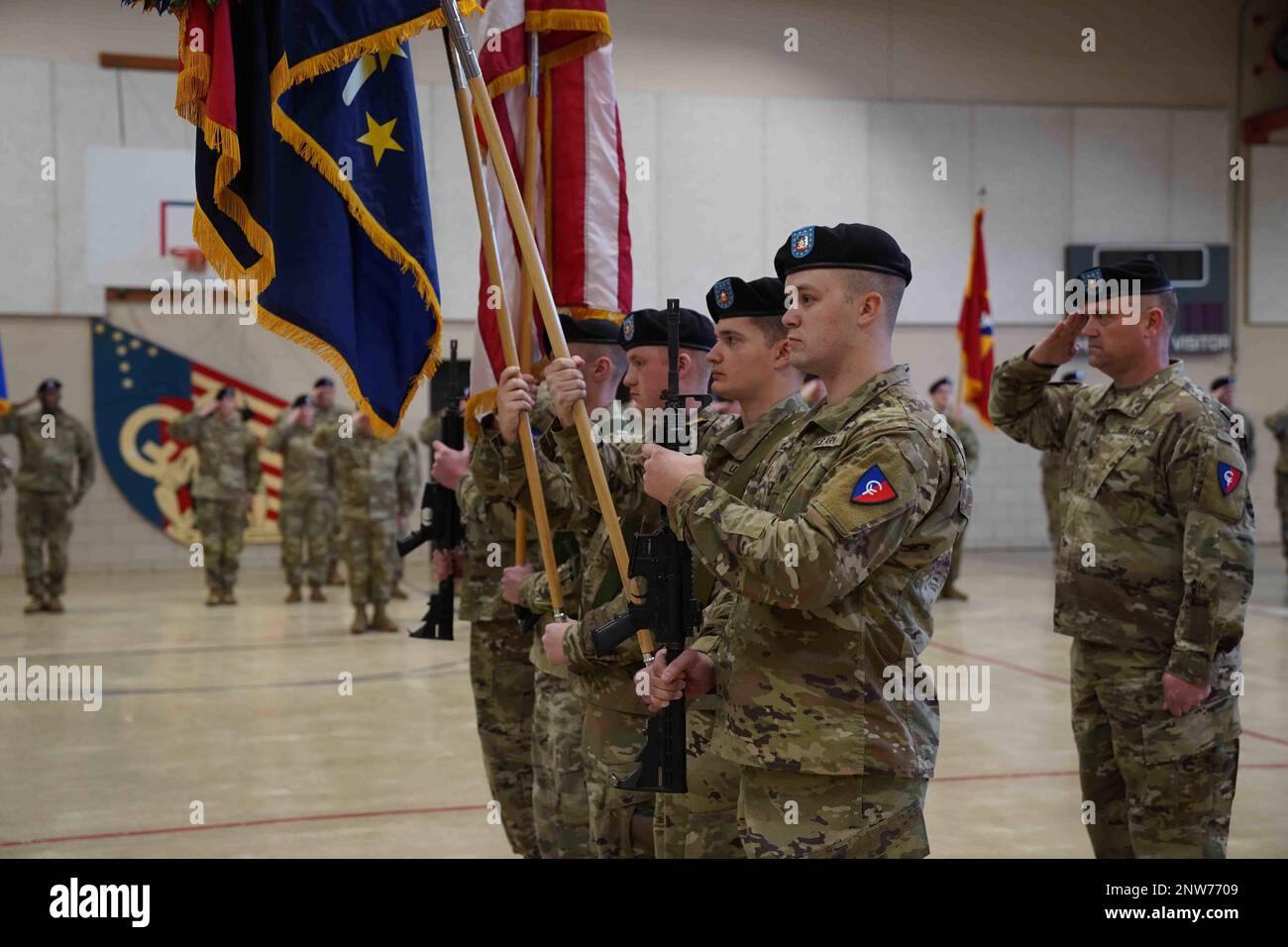 Soldiers with the 38th Infantry Division present arms during a change ...