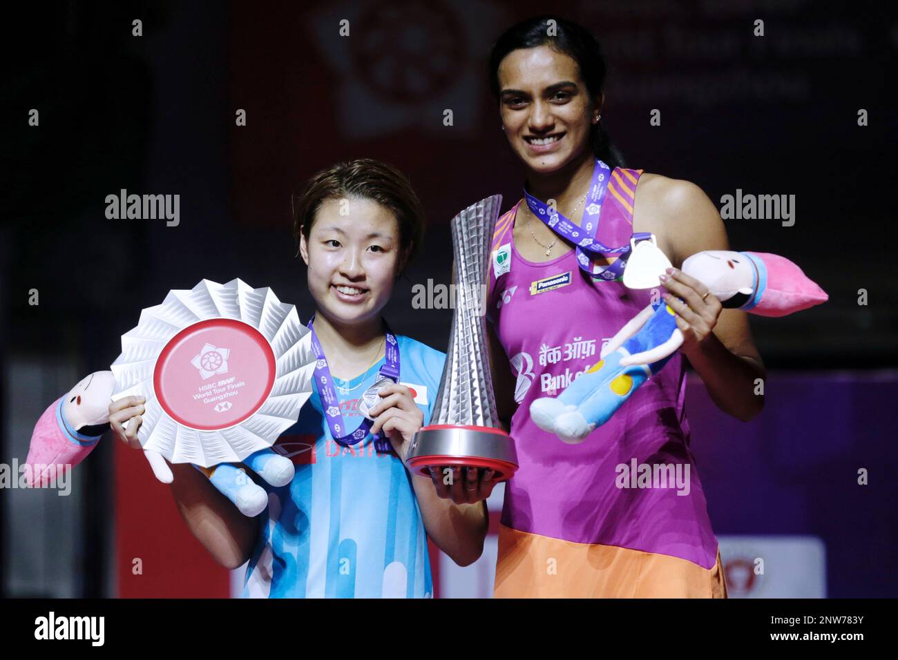 Japan's Nozomi Okuhara, left, and India's Pusarla V. Sindhu, right ...