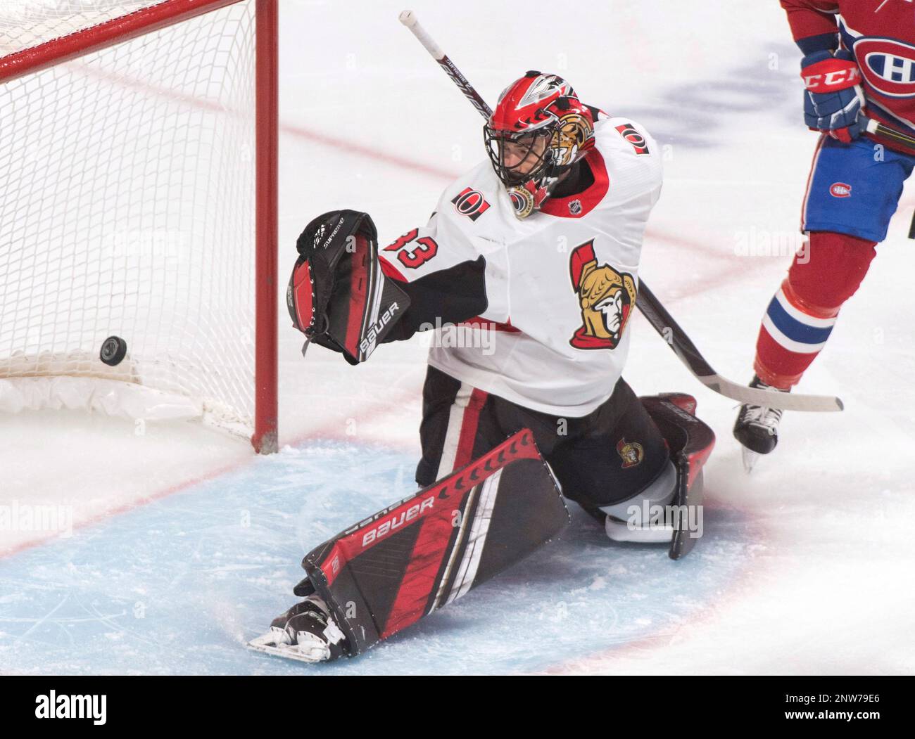 Ottawa Senators goaltender Mike McKenna looks back at the puck after ...
