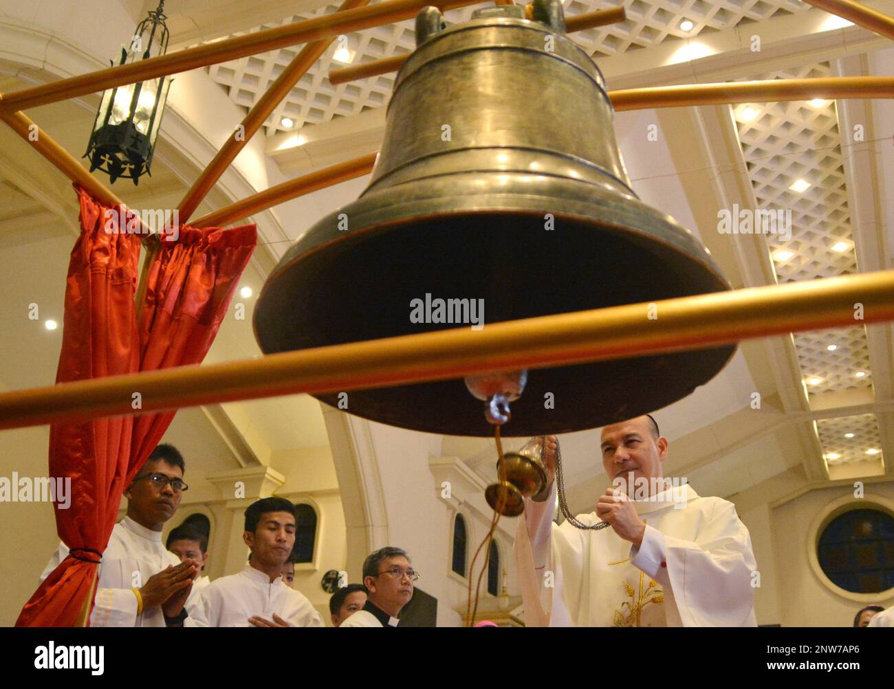 Roman Catholic Bishop Rex Ramirez, blesses one of the three church ...