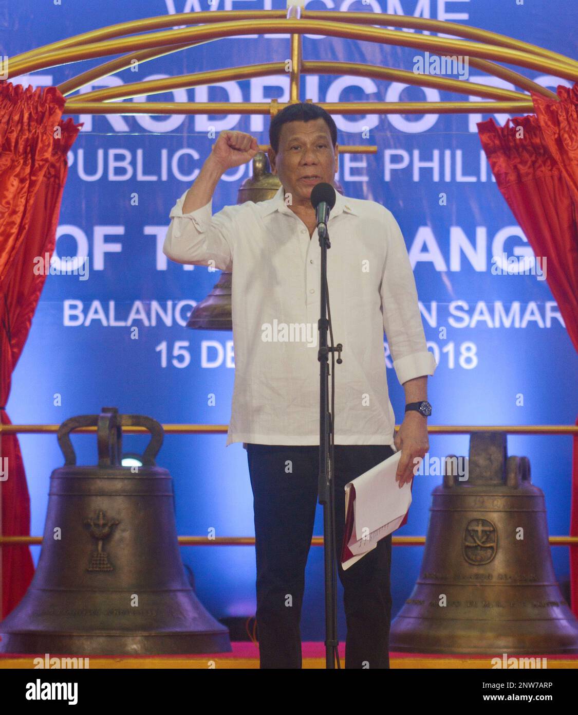 Philippine President Rodrigo Duterte clenches his fist while addressing ...