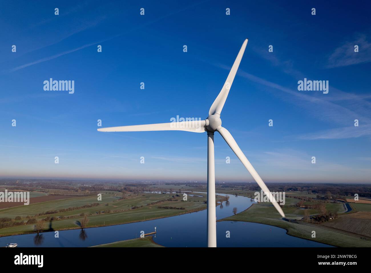 Contrasting closeup of wind turbine and against clear blue sky in The ...