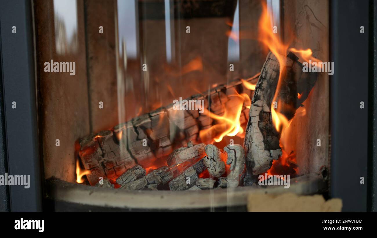 Fire burning inside chimney fireplace at home Stock Photo - Alamy