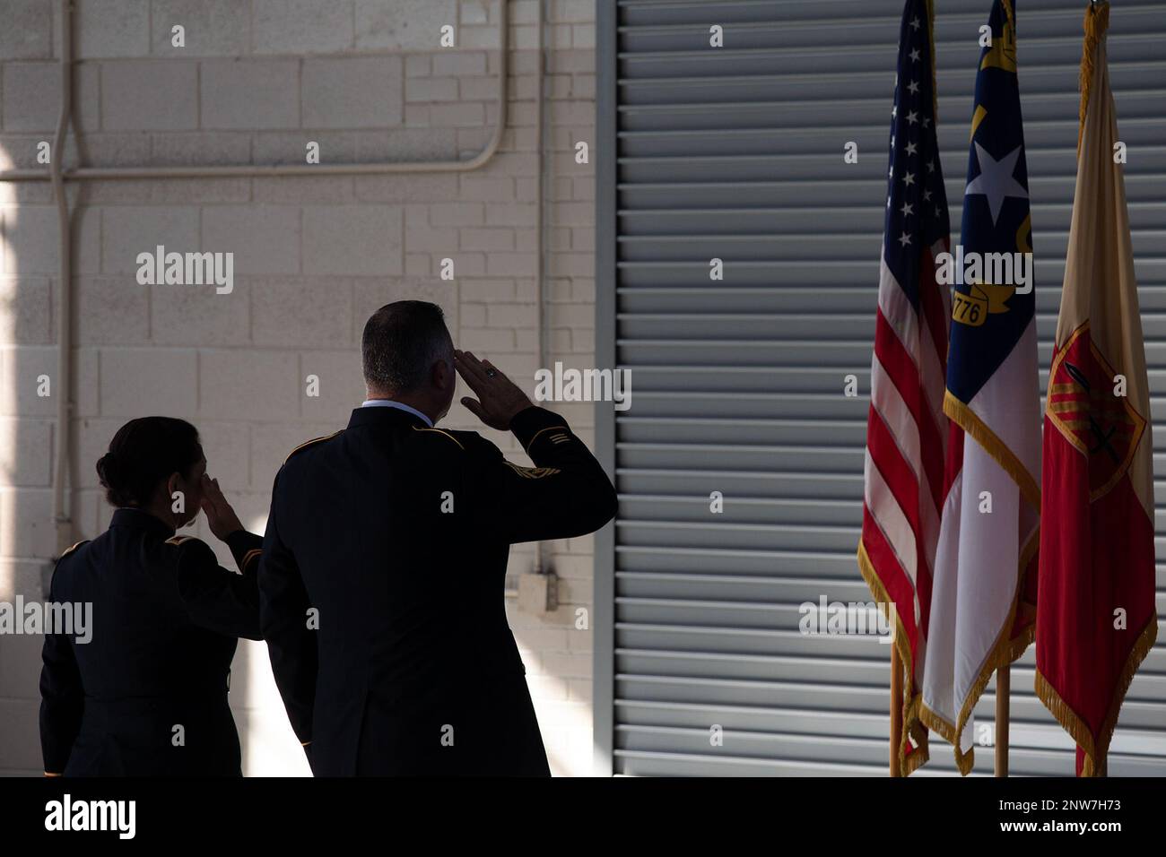Command Sgt. Maj. Randy Ly, right, completes his last official duty for ...
