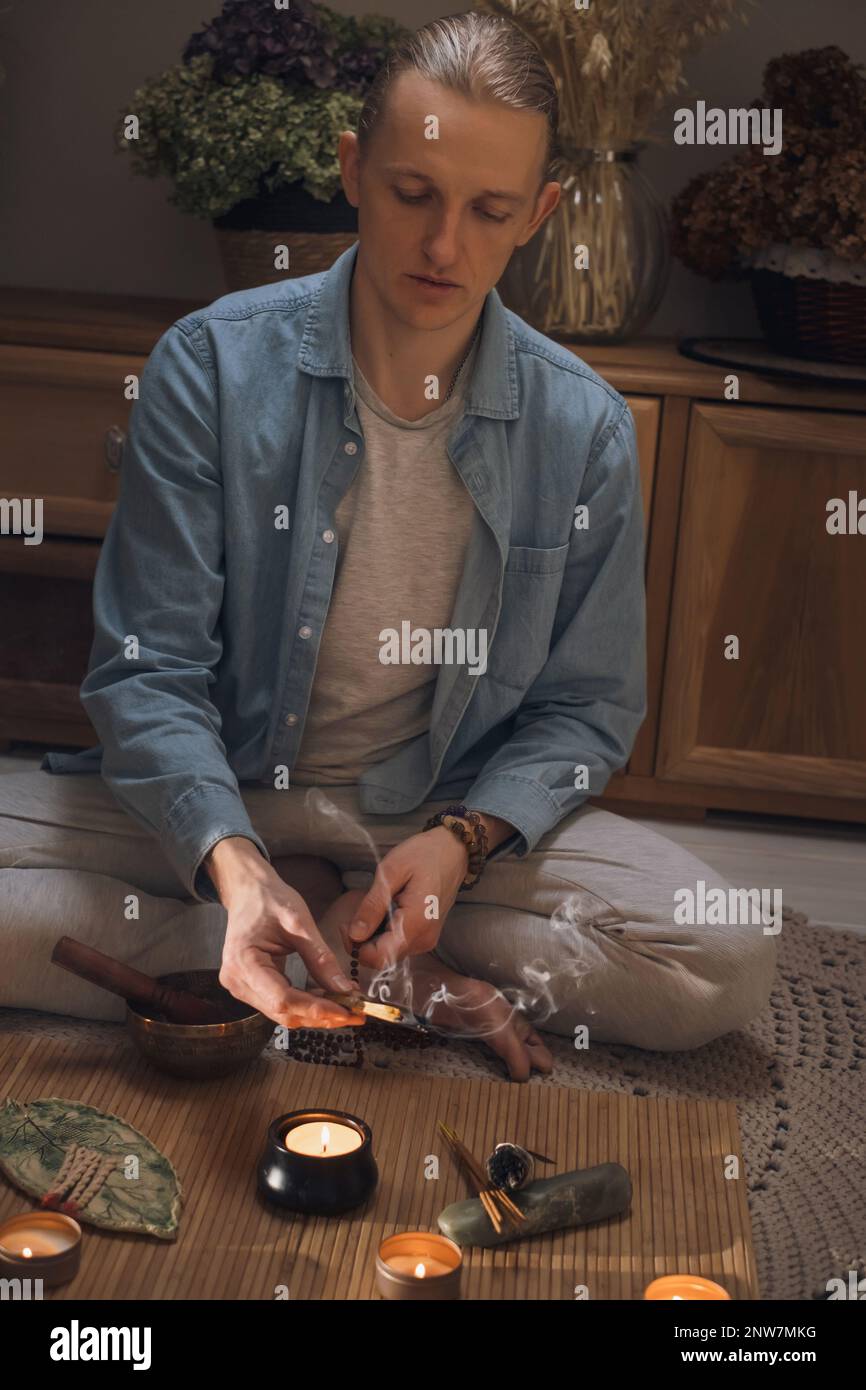 Preparing the space for esoteric practice with the lighting of incense ...