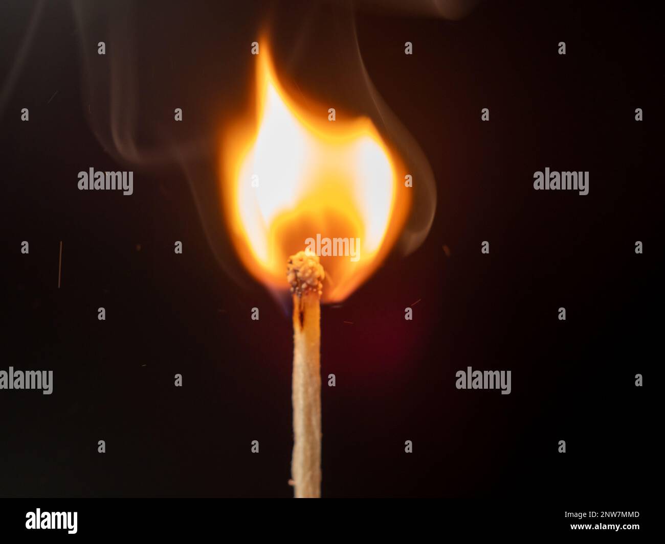 Burning match on a black background. Flame from a lit match. Close-up ...
