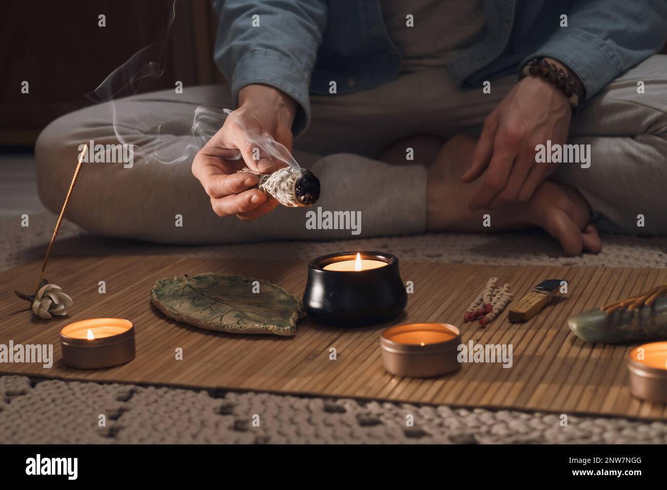 Preparing the space for esoteric practice with the lighting of incense ...