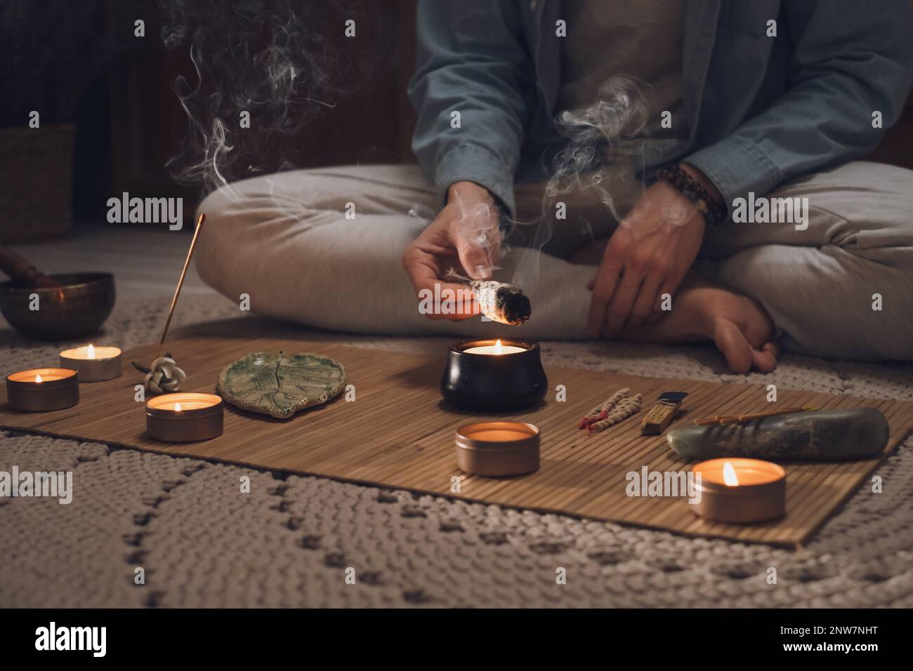 Preparing the space for esoteric practice with the lighting of incense ...