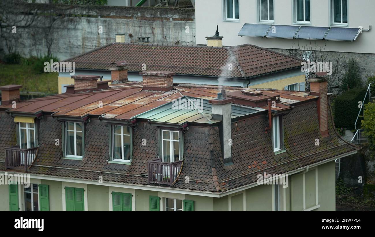 Traditional European building rooftop with Chimney smoke Stock Photo ...
