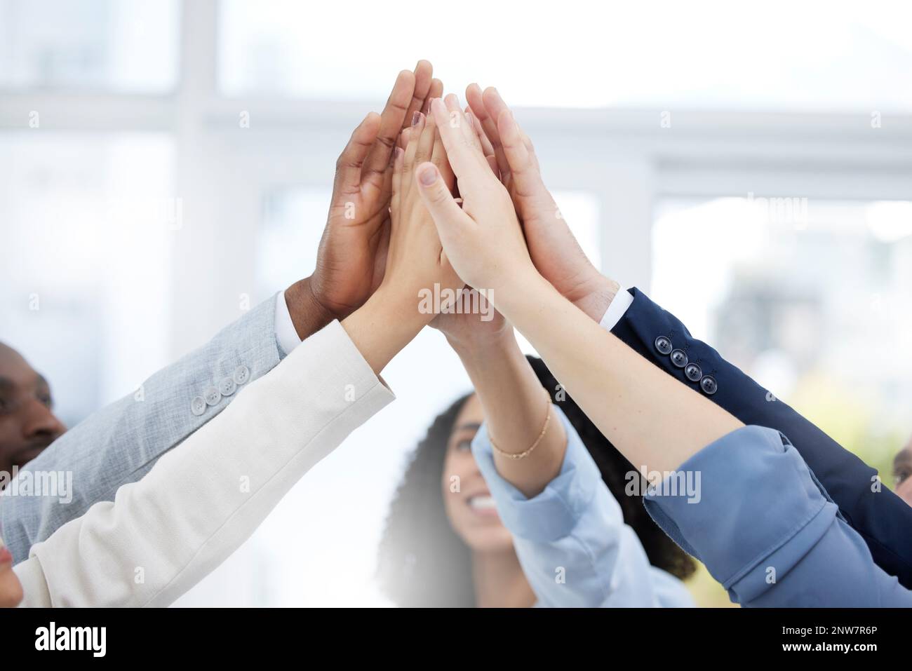 Success, high five and teamwork with hands of business people for community, diversity and ...