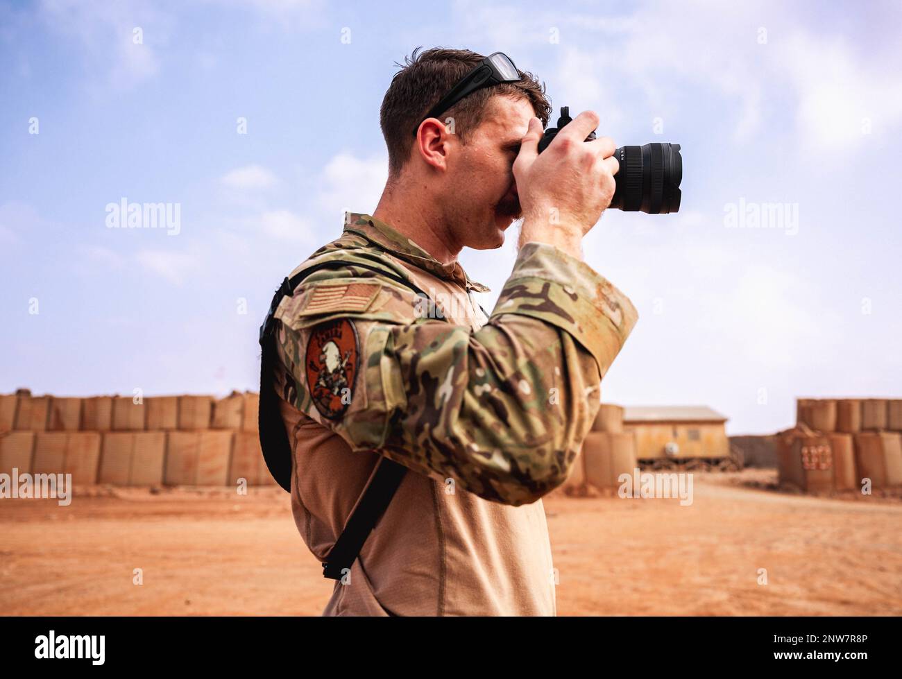 U.S. Air Force Staff Sgt. Joseph LeVeille, a member of the 4th Combat Camera Squadron, takes a ...