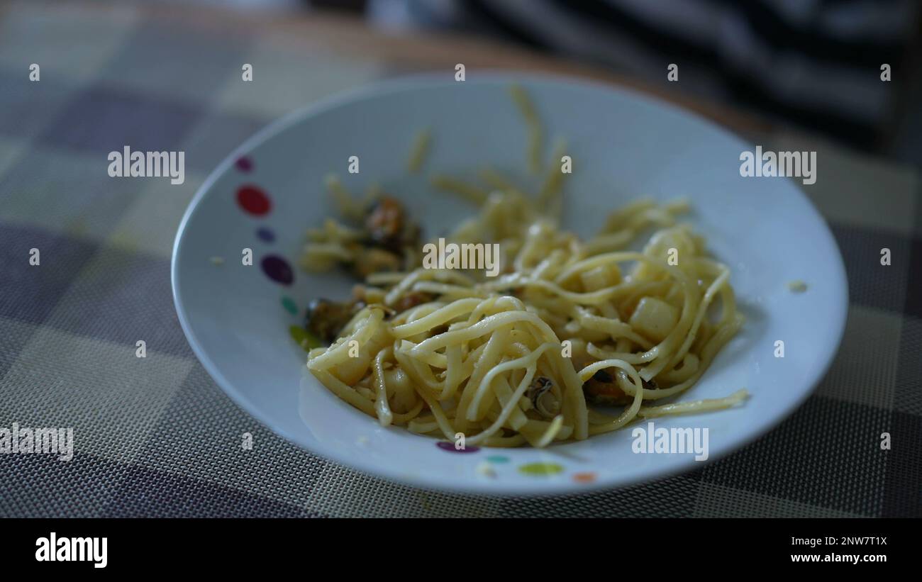 Pasta spaghetti noodles on plate leftovers Stock Photo - Alamy