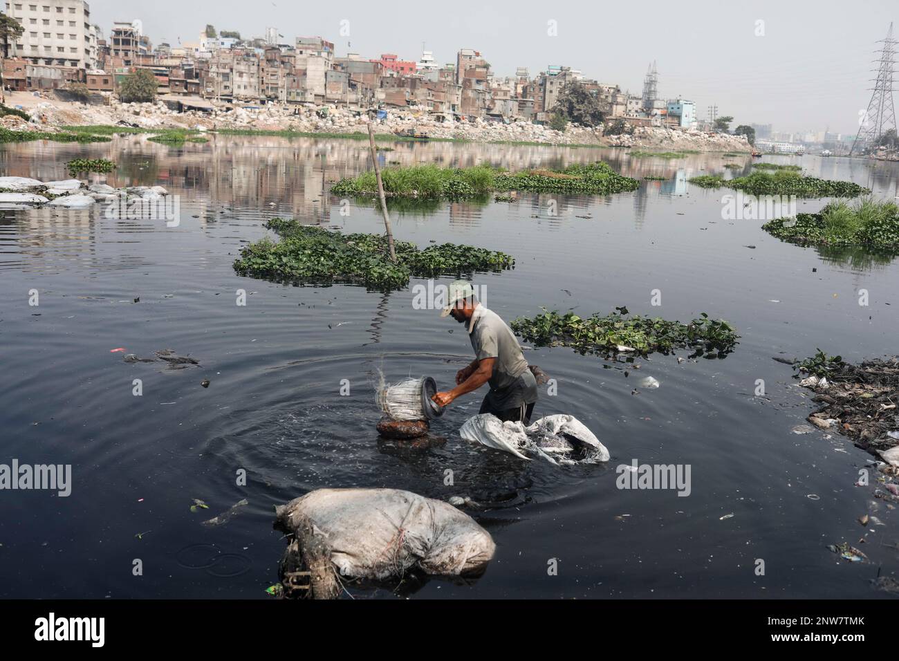 Dhaka, Bangladesh. 28th Feb, 2023. People are washing plastic wastes in ...