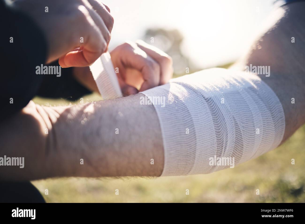 Hands, arm bandage and first aid after injury, workout or exercise ...