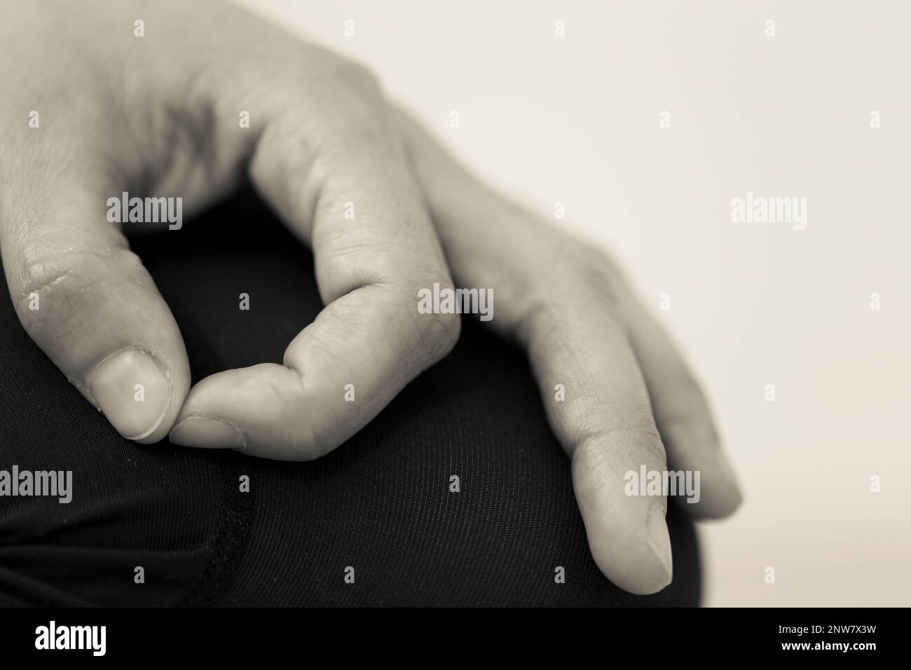 Black and white horizontal closeup of hand gesture or mudra with palm ...