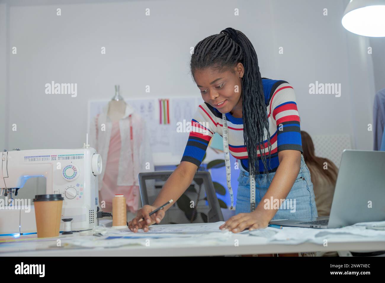 Women working together Small business, SME, tailoring designs for ...