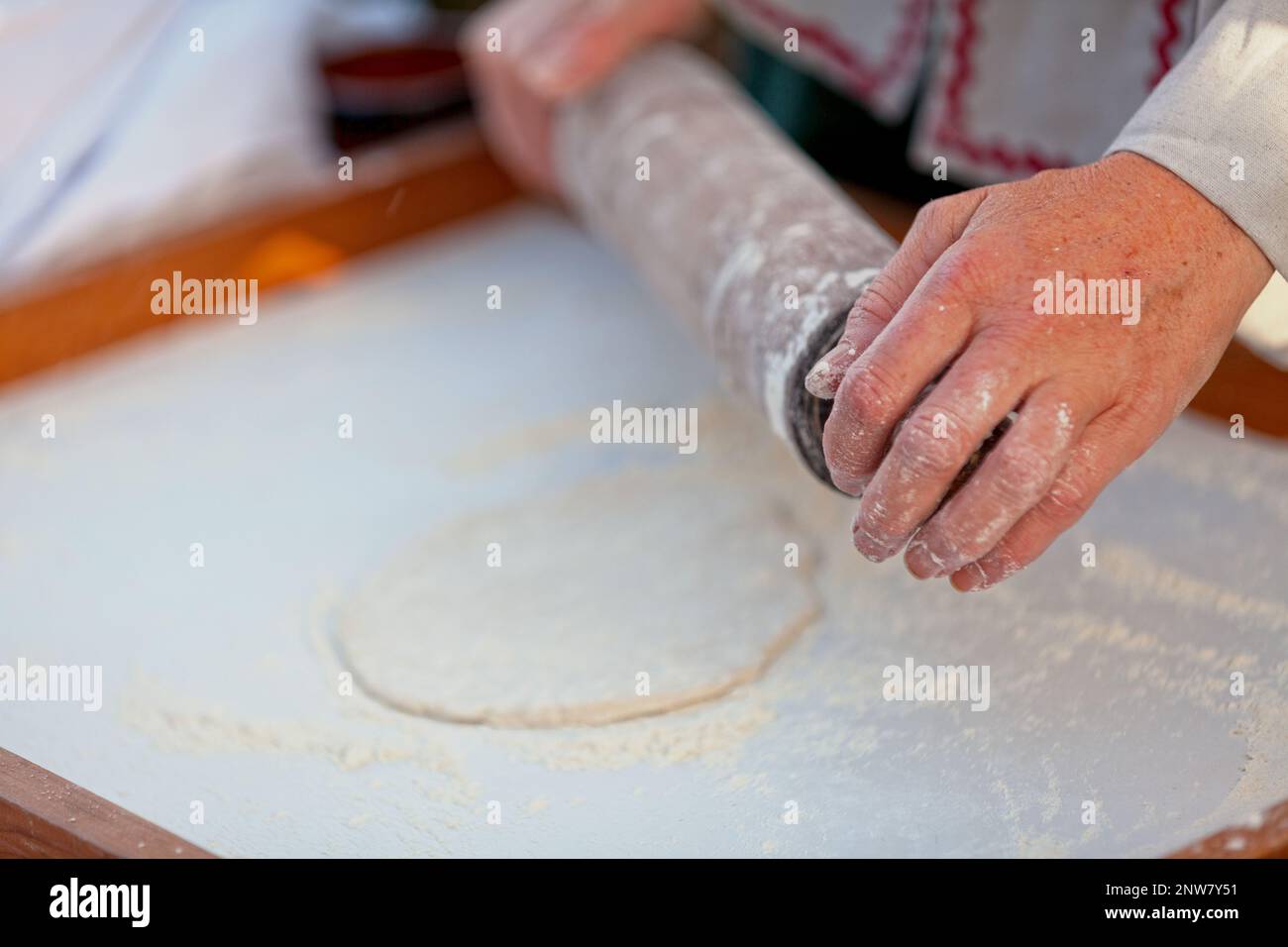 Medieval baker making a fouace, (also known as fouée). It is a round ...
