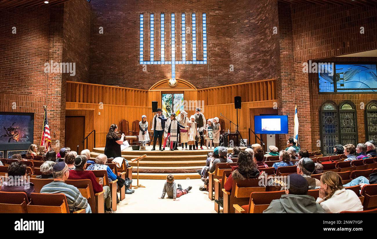 James Mockler, of Grey, center, sits on the floor after moving from his ...