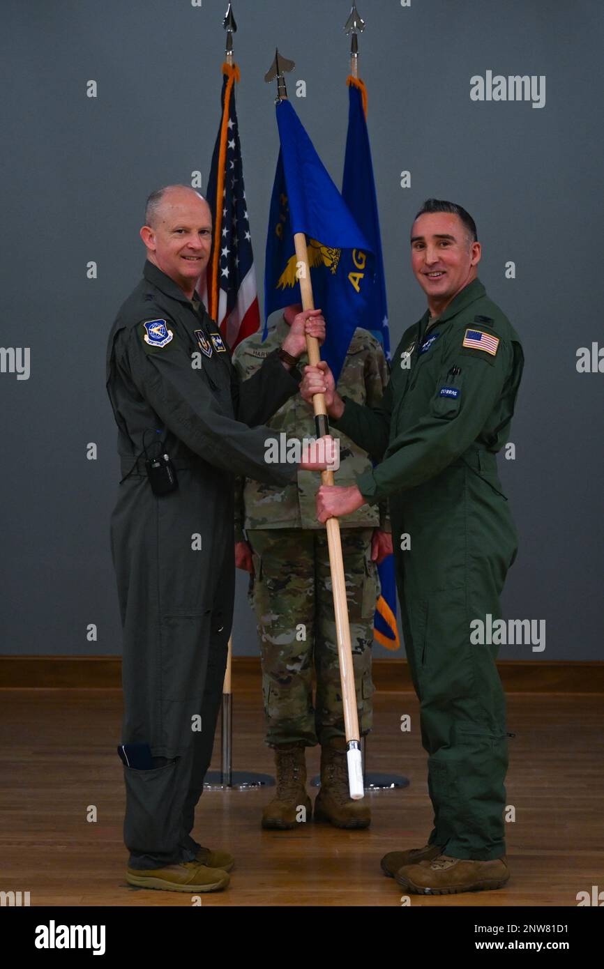 Maj. Gen. Bret Larson, 22nd Air Force commander (left), presents the ...